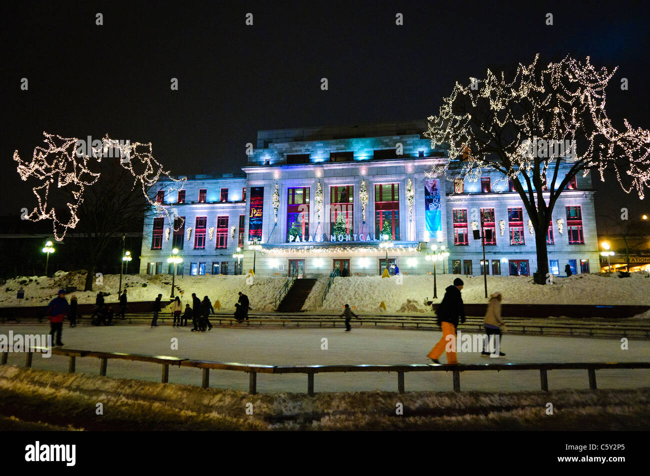 QUEBEC CITY, Canada — Ice skaters glide across a rink set up in front ...