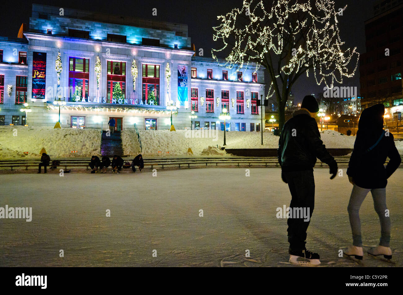QUEBEC CITY, Canada — Ice skaters glide across a rink set up in front ...