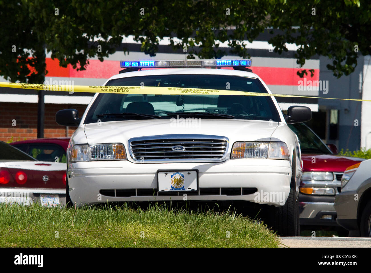 Police car with crime scene tape Stock Photo - Alamy