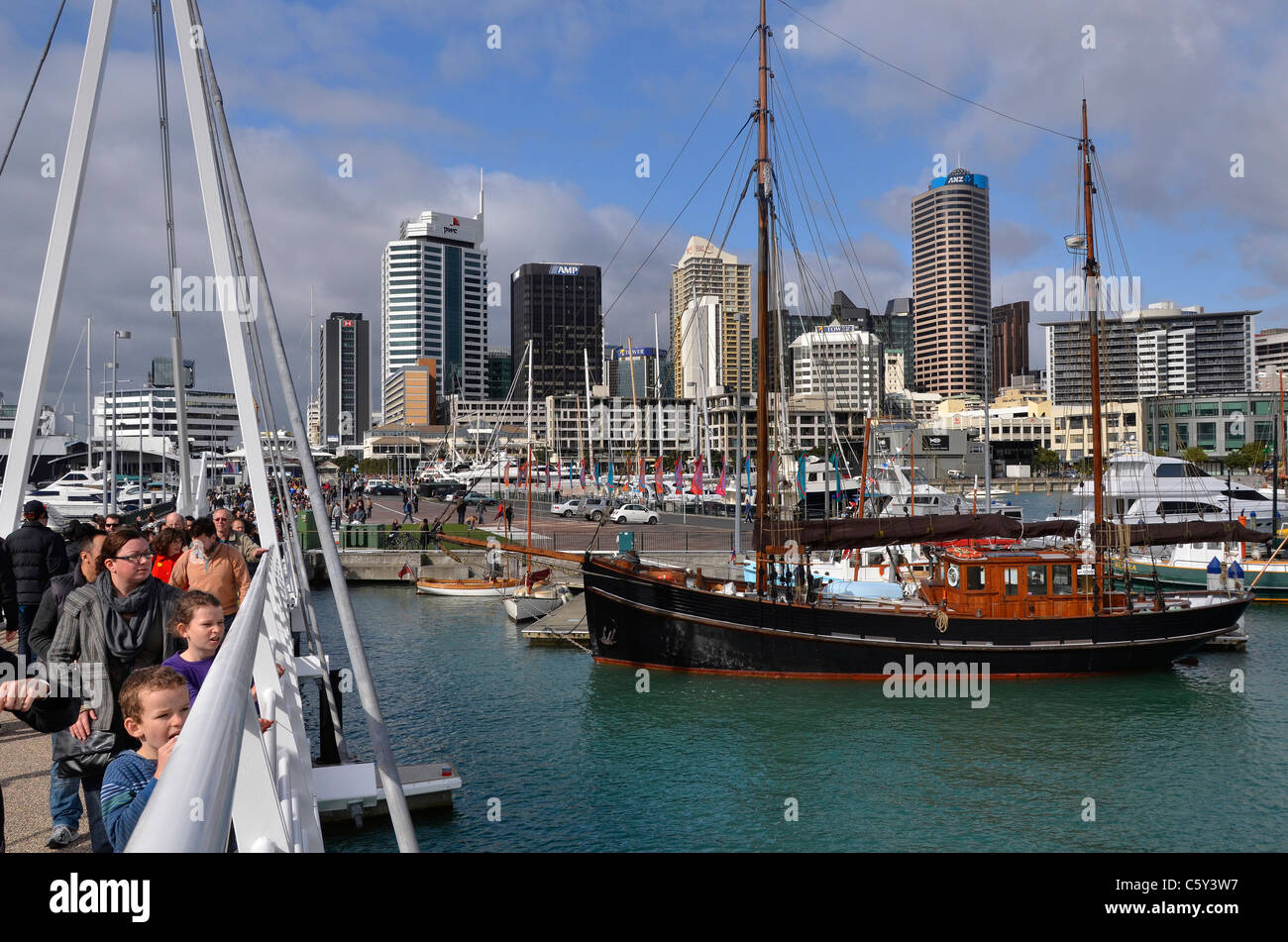 Pedestrians crossing the Wynyard Crossing Bridge, Viaduct Harbour ...