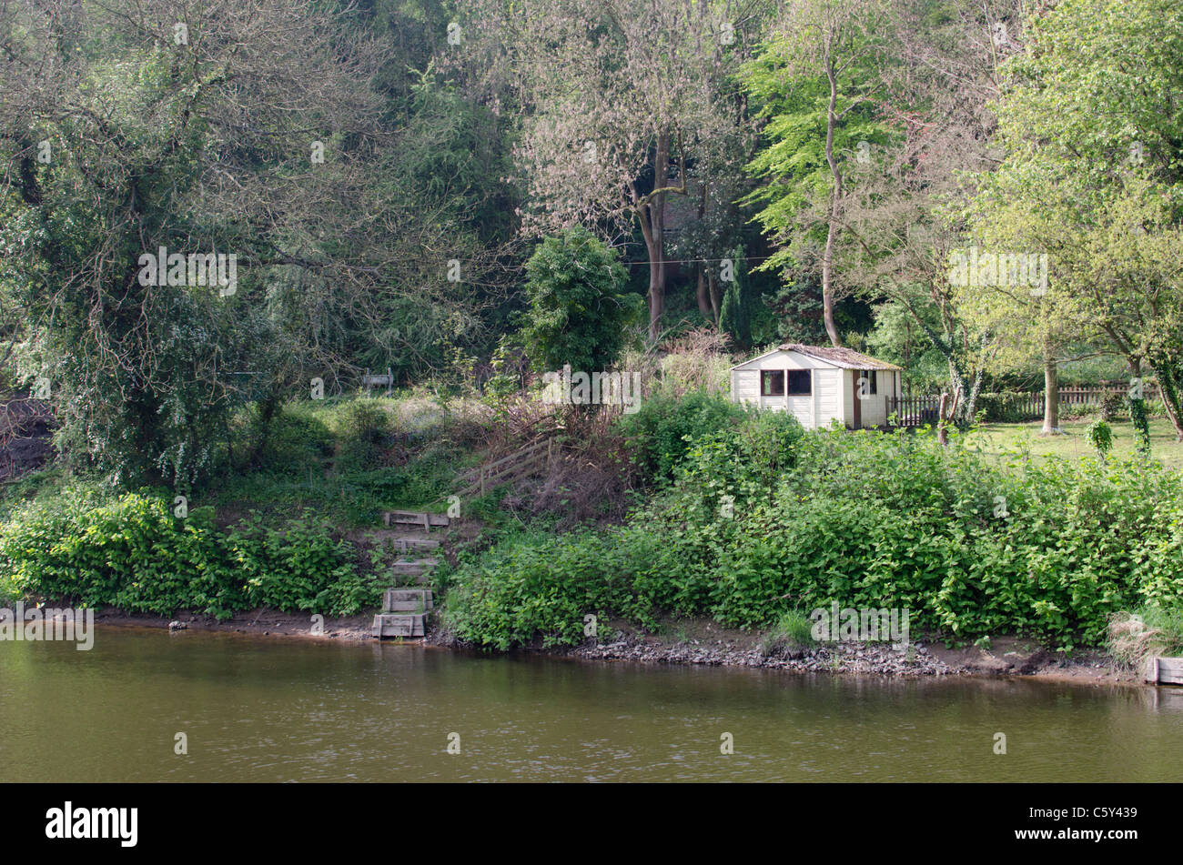 Cabin beside a river Stock Photo - Alamy
