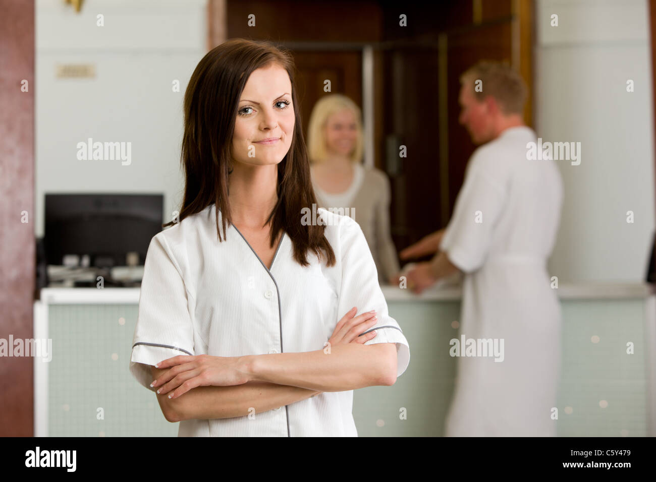 Portrait of a young female professional spa employee Stock Photo - Alamy