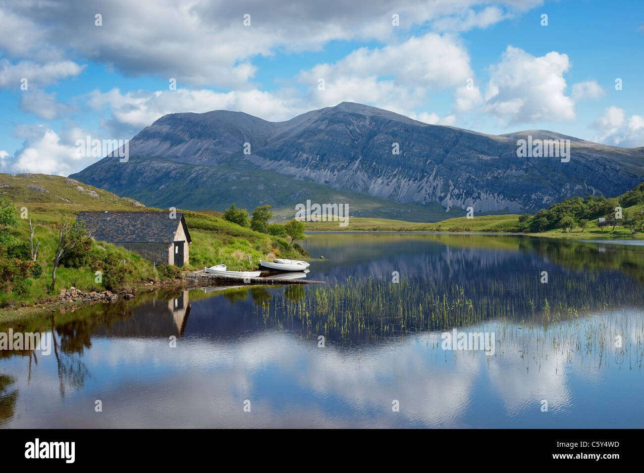Boat house on Loch Stack with Arkle in distance, Sutherland, Highland ...