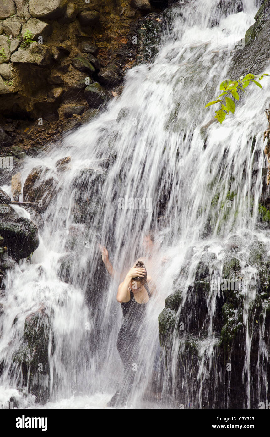 Girl under waterfall hi-res stock photography and images - Alamy