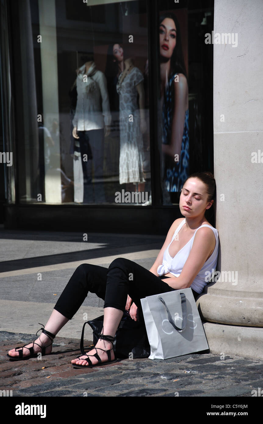 Tired women shopper resting in Covent Garden, West End, City of ...