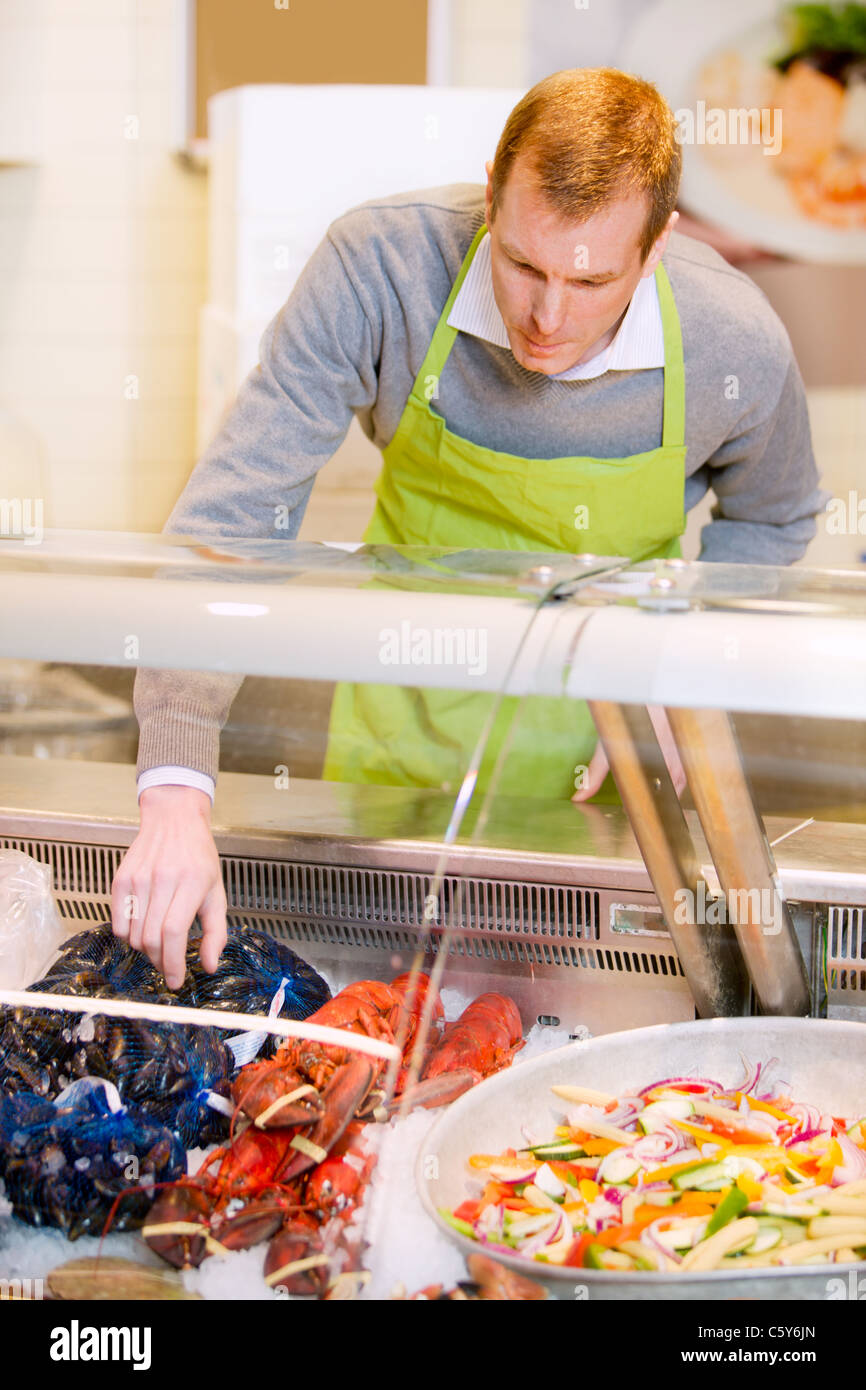 A fresh fish counter and a grocery store Stock Photo - Alamy