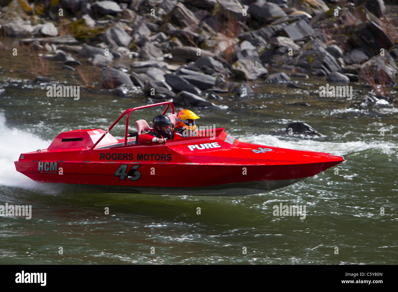 Ryan Rogers powers through Time Zone rapids in his red #46 boat during ...