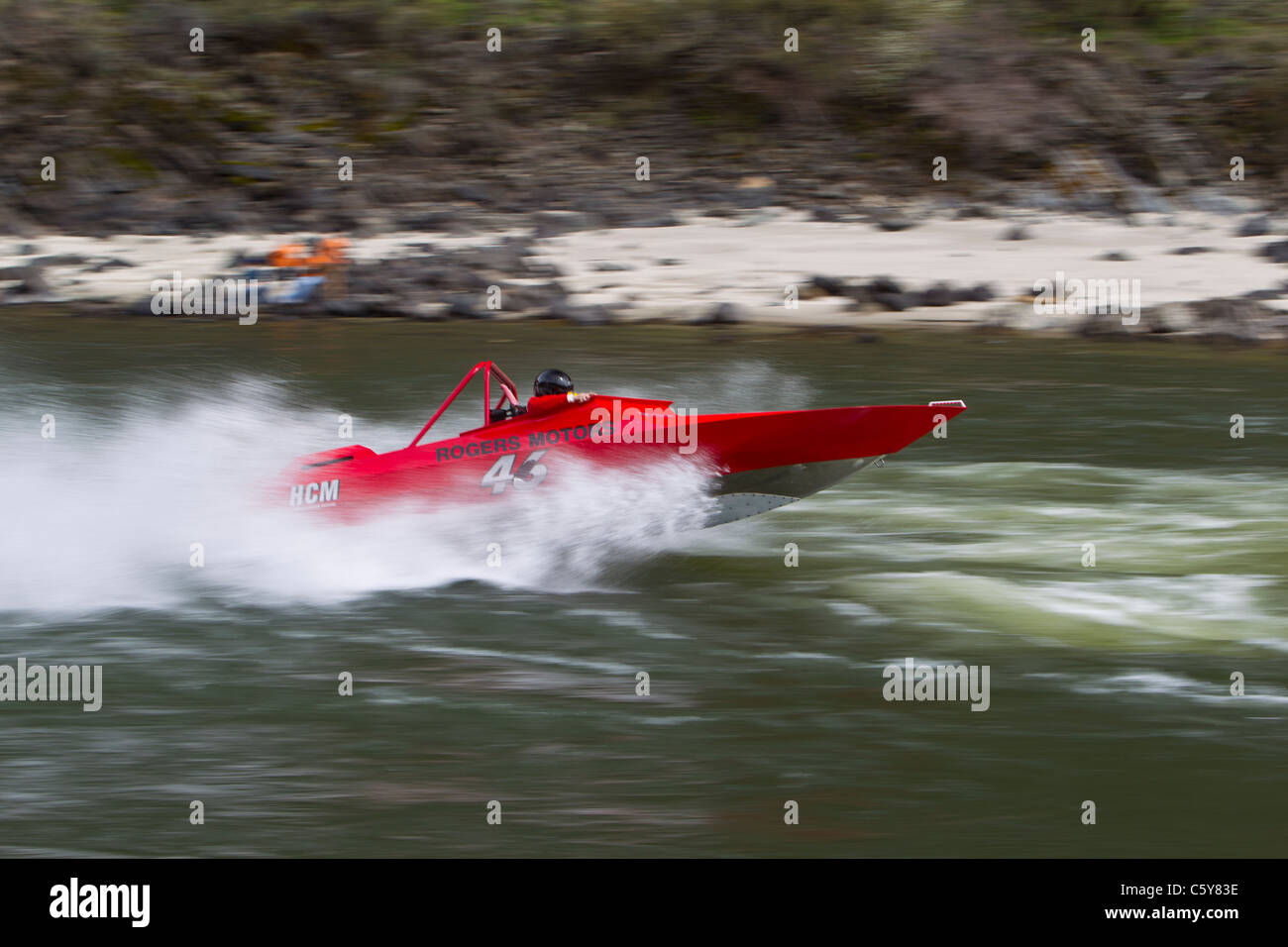 Ryan Rogers powers through Time Zone rapids in his red #46 boat during ...