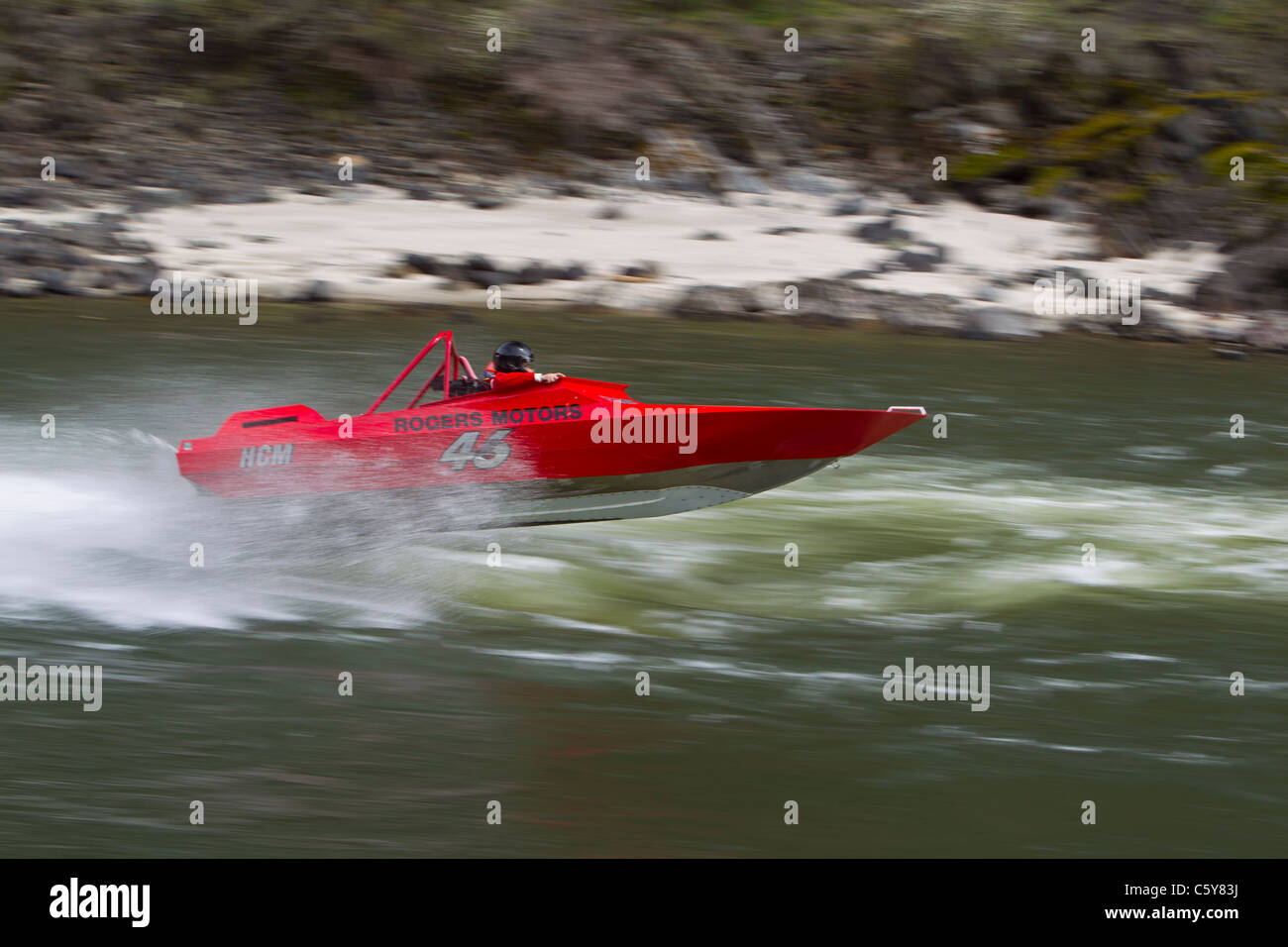 Ryan Rogers powers through Time Zone rapids in his red #46 boat during ...