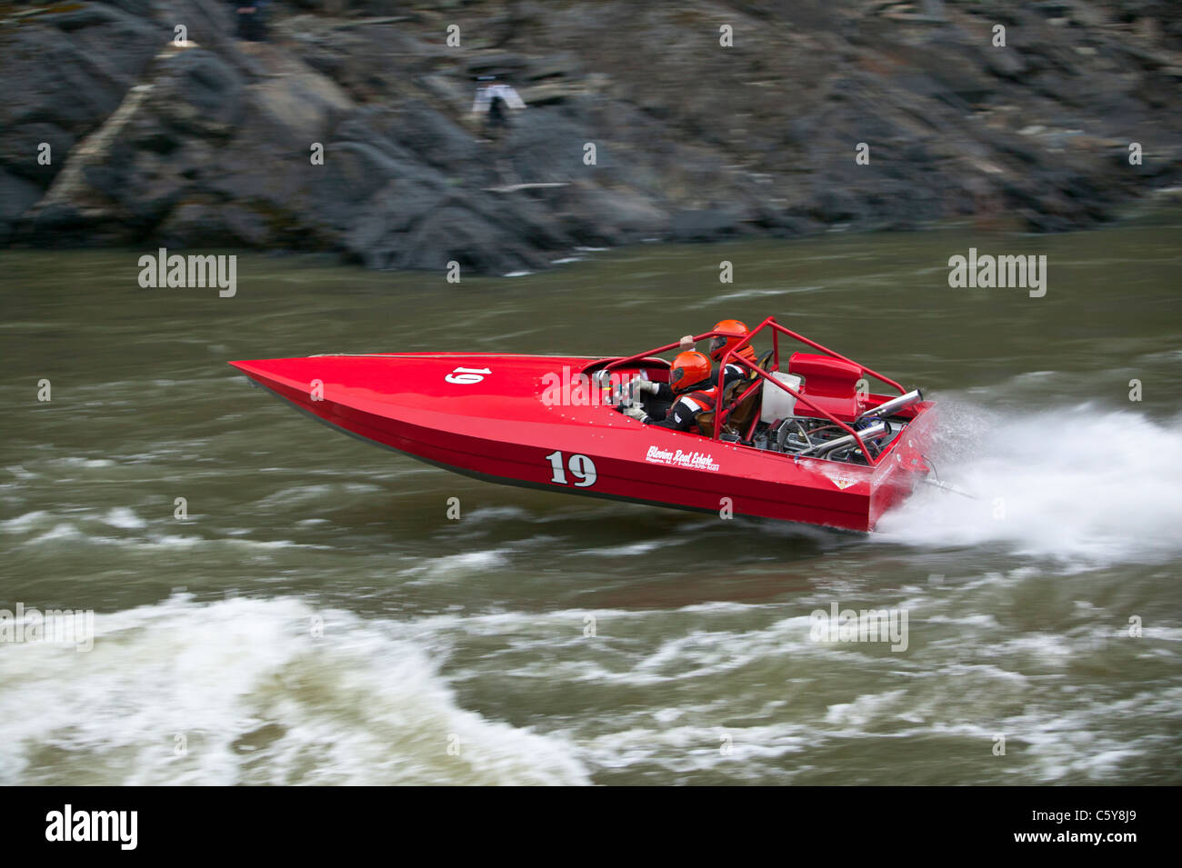 Mike Egbers powers through Time Zone rapids in his red #19 boat during ...