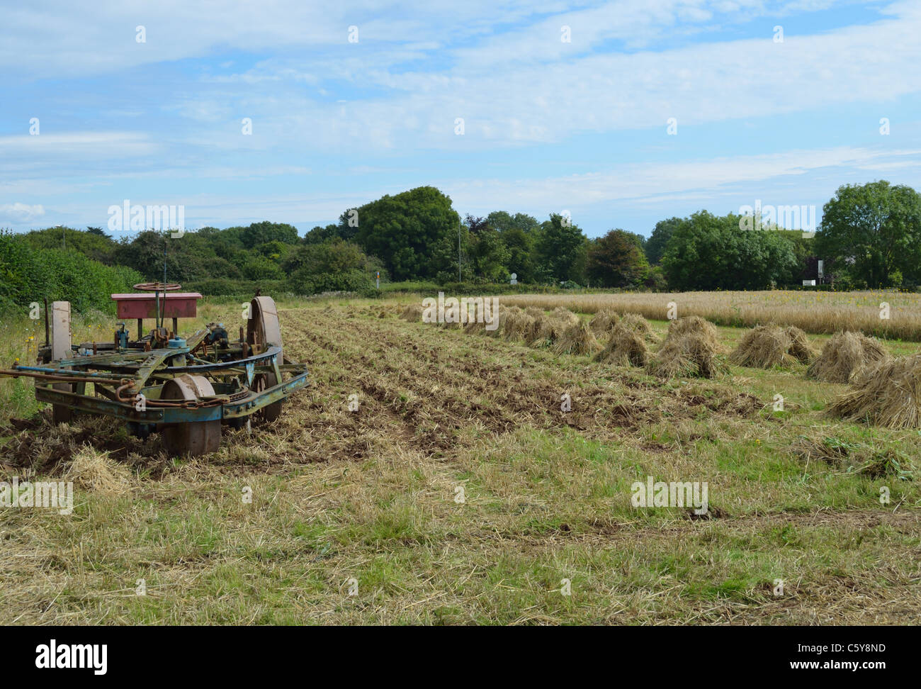 Ploughed Field With Old Plough Stock Photo - Alamy