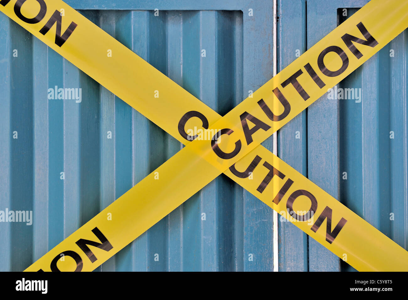 Closeup on yellow caution signage tape Stock Photo - Alamy