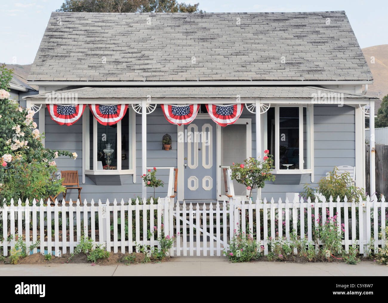 Classic historic American colonial era wooden house with white picket ...
