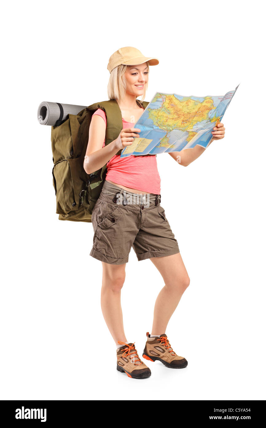 Full length portrait of female hiker looking at map Stock Photo - Alamy