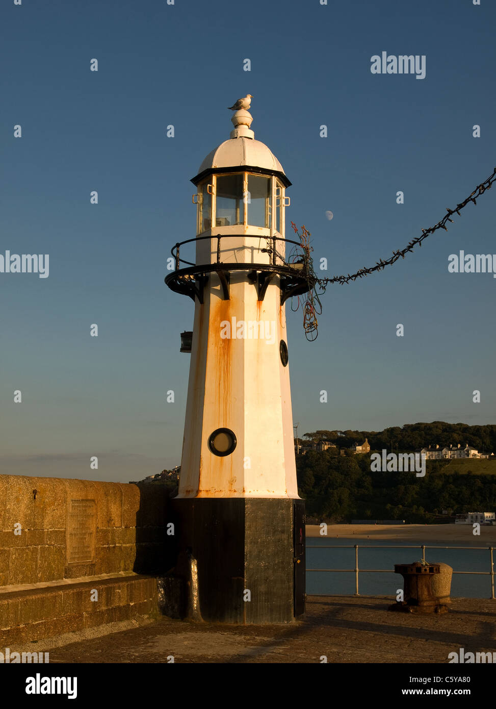 White cast iron lighthouse at the end of Smeaton's Pier St Ives ...