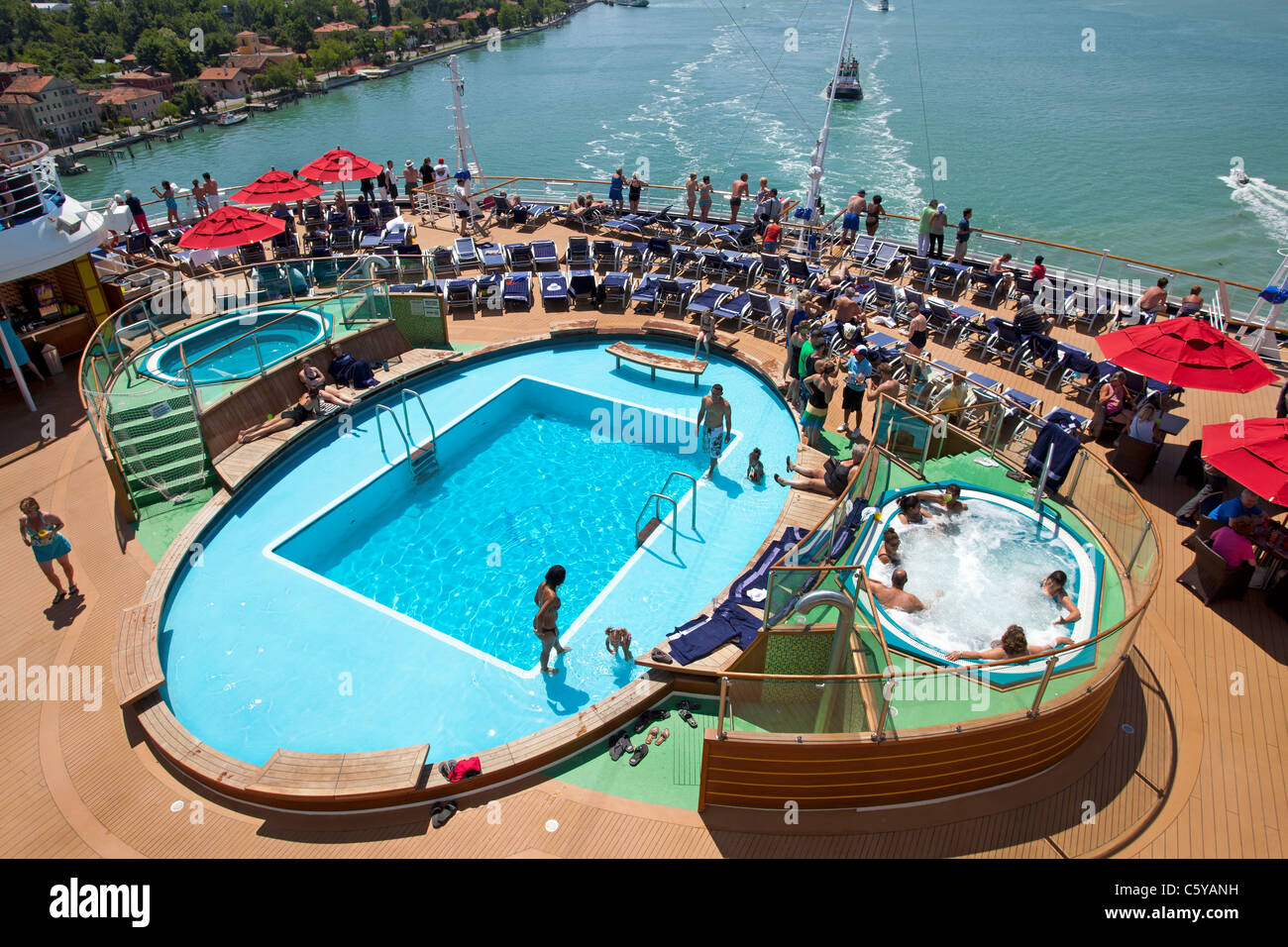 Pools aboard a cruise ship in the Mediterranean Sea. Vacationers and ...