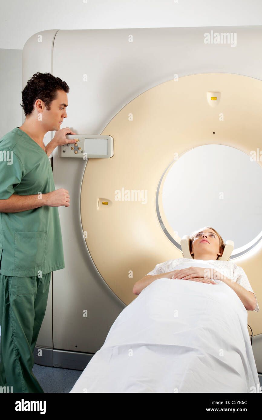 A patient and CT Scan Technician preparing for an x-ray Stock Photo - Alamy