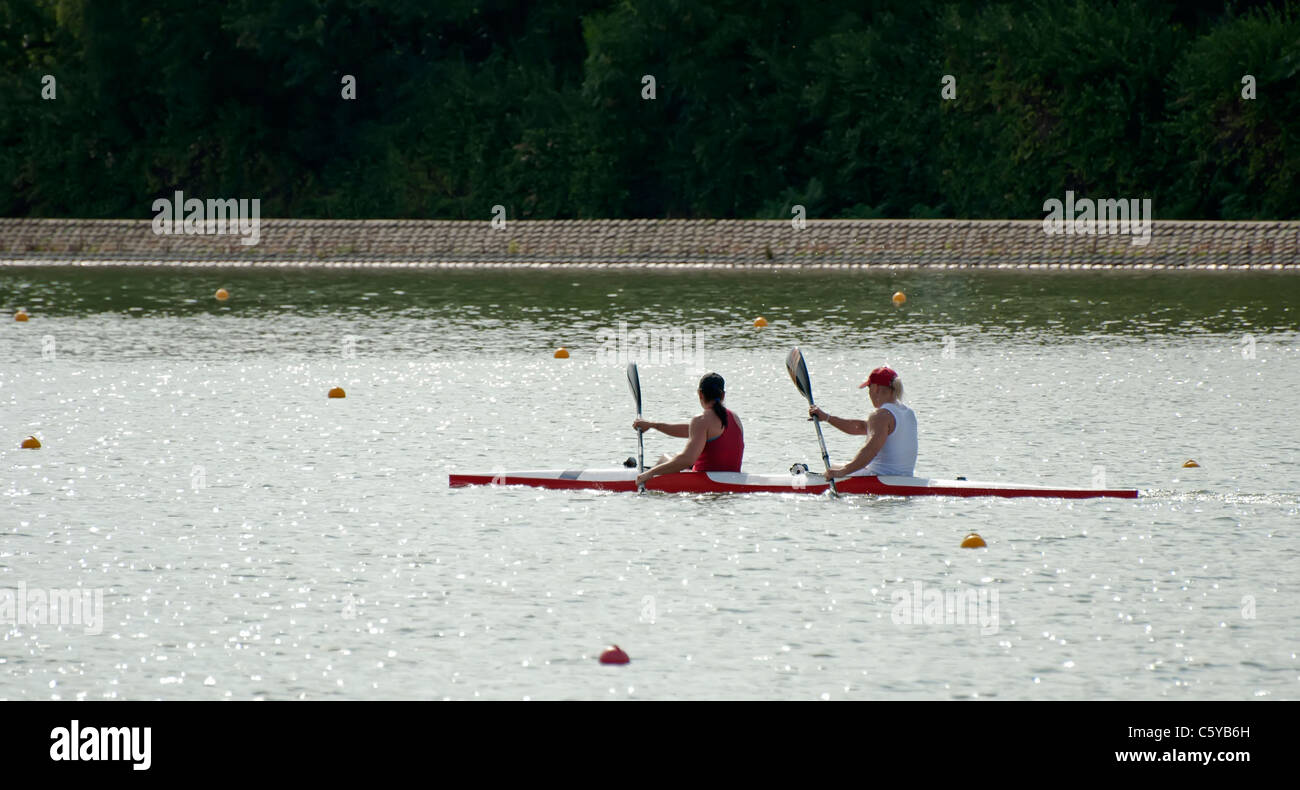 Two rowers in a boat in line Stock Photo - Alamy