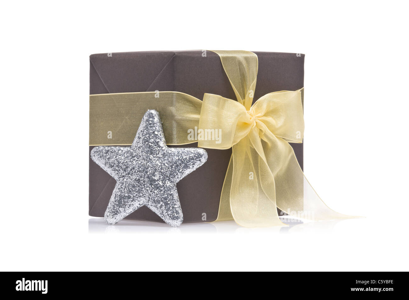 Present decorated with a glitter star, over white Stock Photo - Alamy