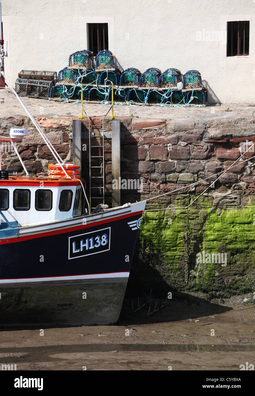 Beached fishing boat Rockhopper LH138 and lobster pots, Dunbar Harbour ...