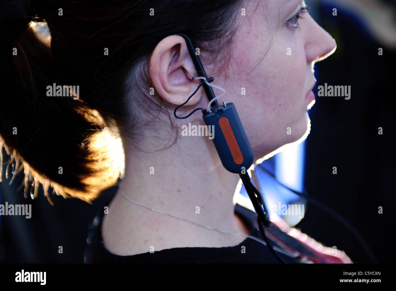 Young female audiology student wearing a hearing aid apparatus for a ...