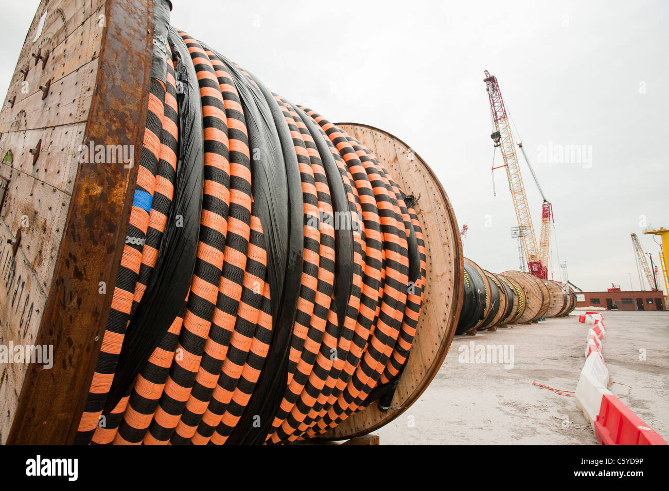 Electric cabling being loaded onto a cable laying vessel for the Walney ...