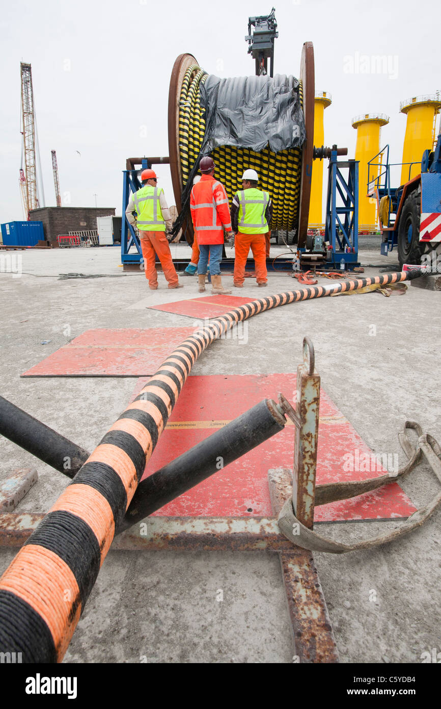 Electric cabling being loaded onto a cable laying vessel for the Walney ...