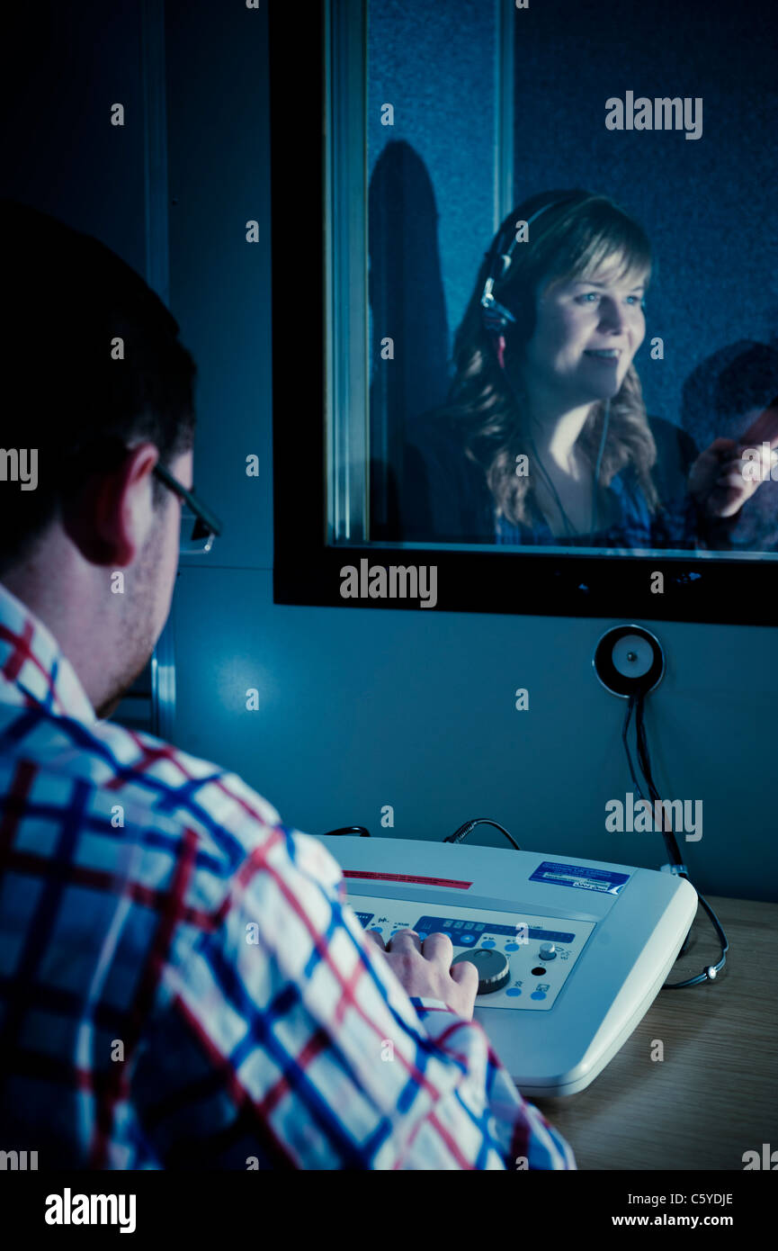 Audiology and deafness sound booth young female 18-20 wearing ...