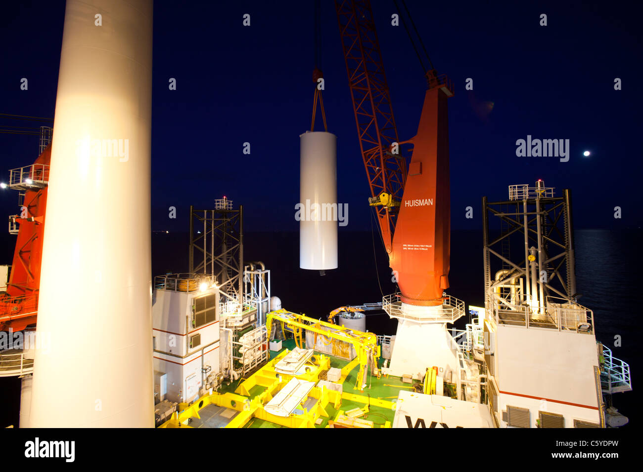 The jack up barge, Kraken, lifting tower pieces onto a wind turbine on ...