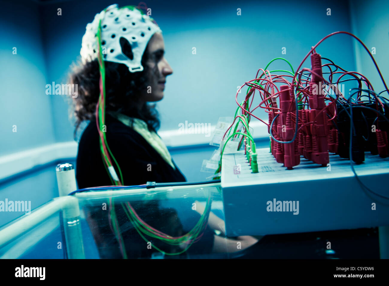 Young female 18-20 taking part in audiology and deafness experiment in ...