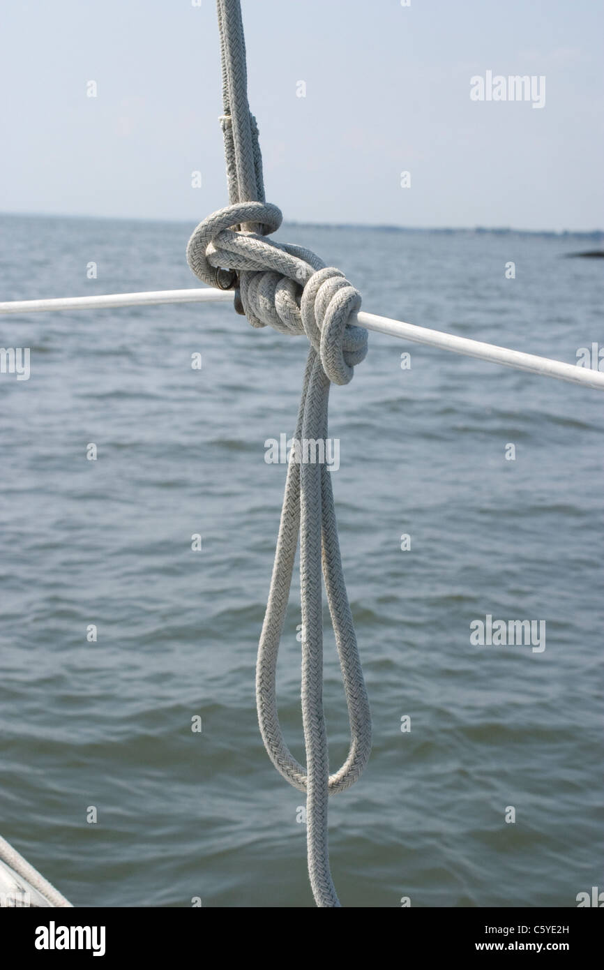A secure line is tied on a sailboat rigging Stock Photo - Alamy
