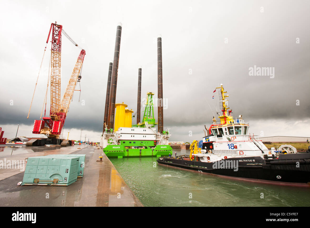 The jack up barge, Goliath being towed out by tug to the Walney ...
