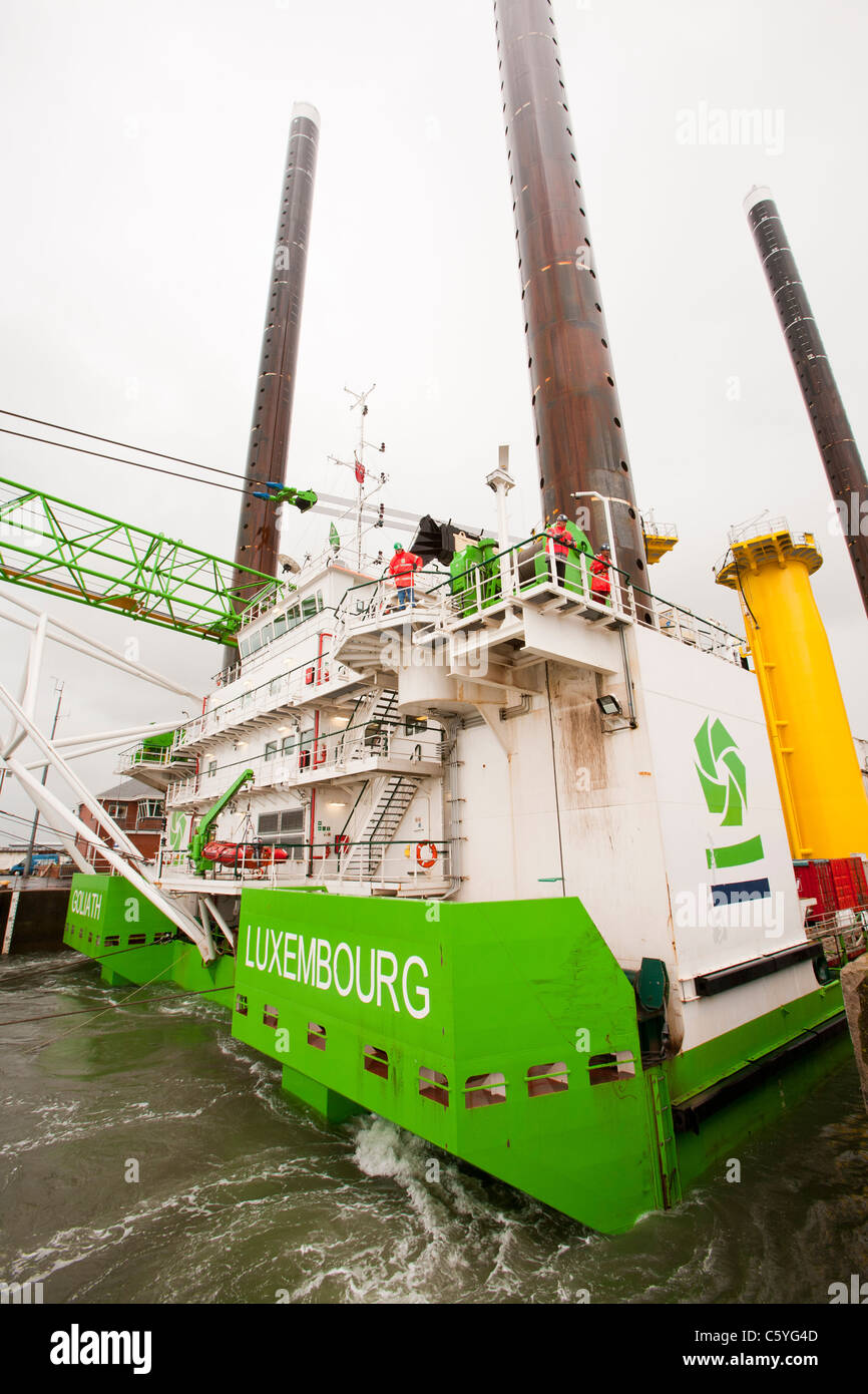 The jack up barge, Goliath being towed out by tug to the Walney ...