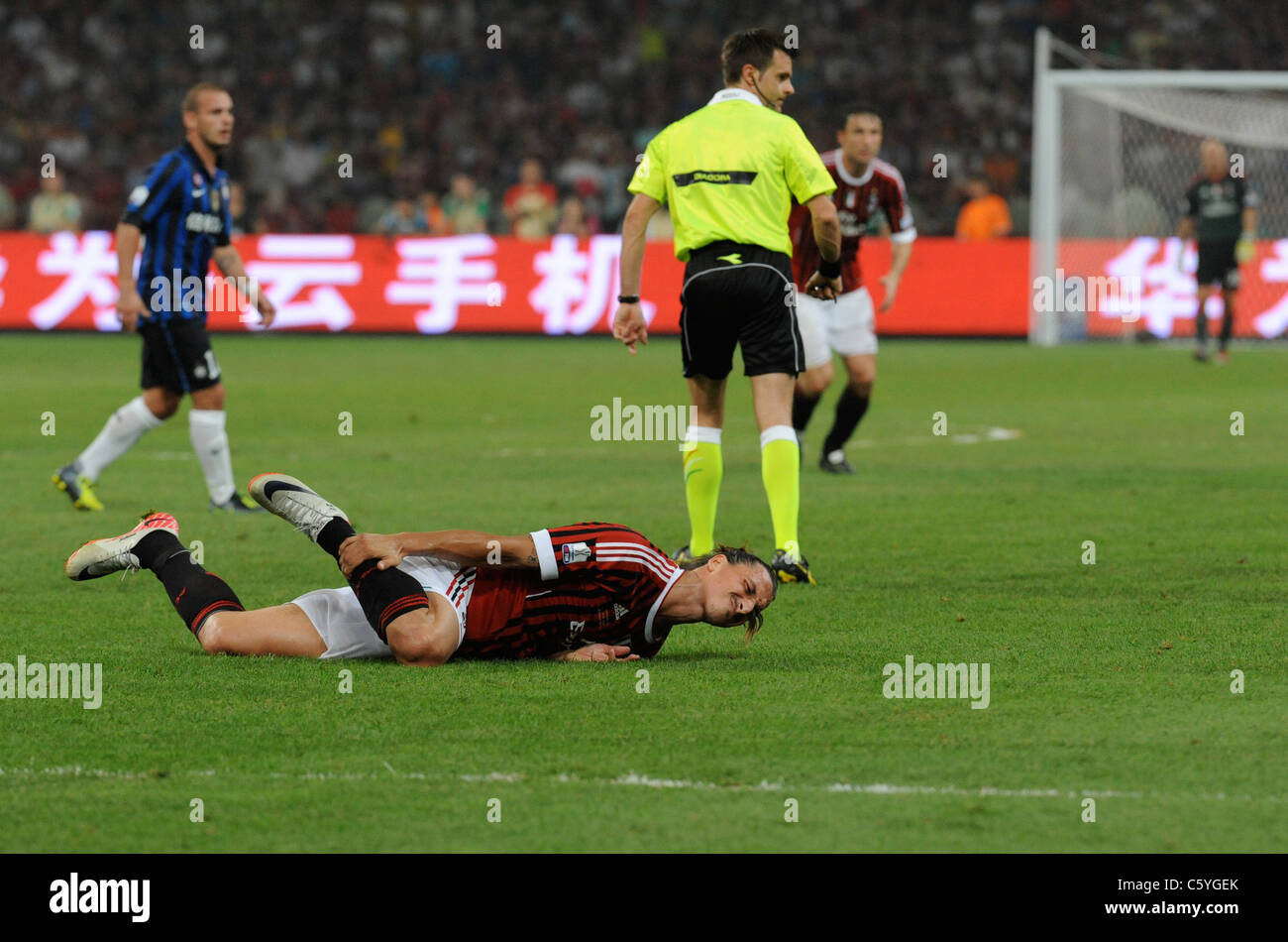 Zlatan Ibrahimovic of AC Milan reacts after a tackle in the Italian ...