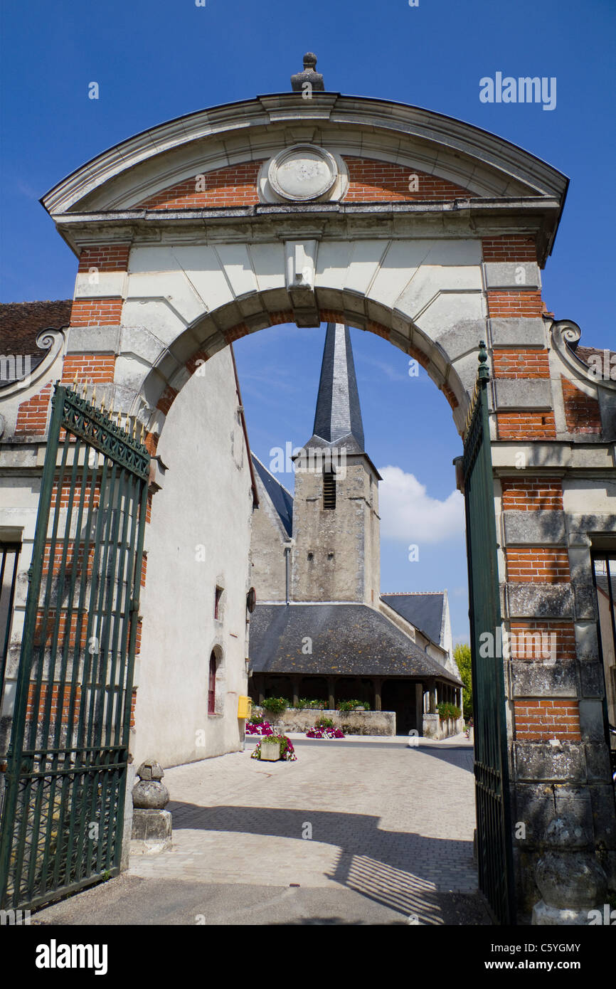 Village Church seen through the gate to the Chateau de Cheverny, Loire ...