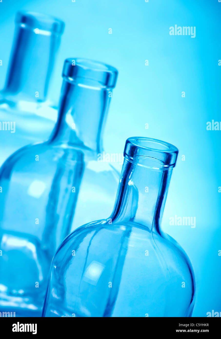 Abstract glass bottle toned in blue color Stock Photo - Alamy