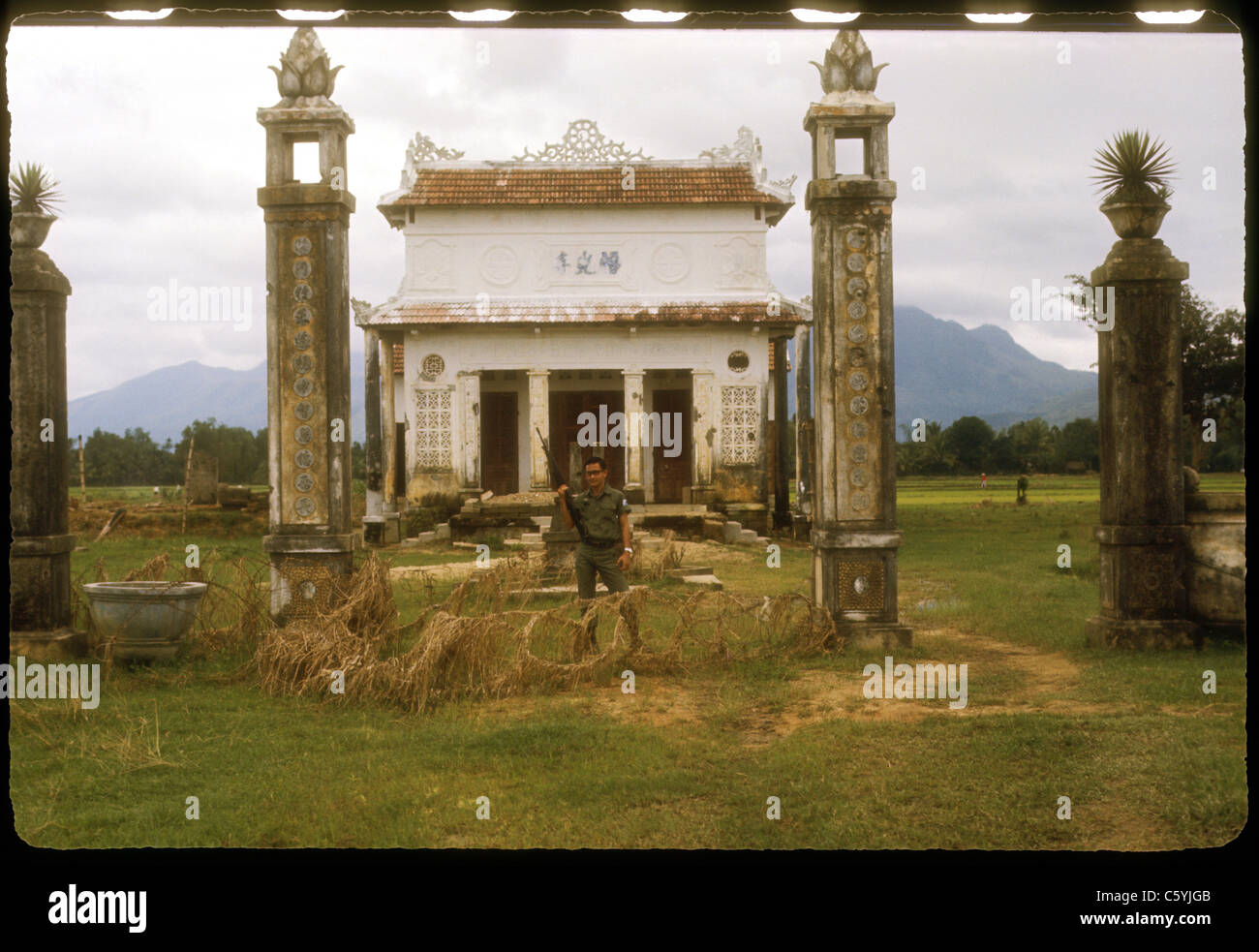 soldier with m-17 outside buddhist building ARVN Army of Republic of ...