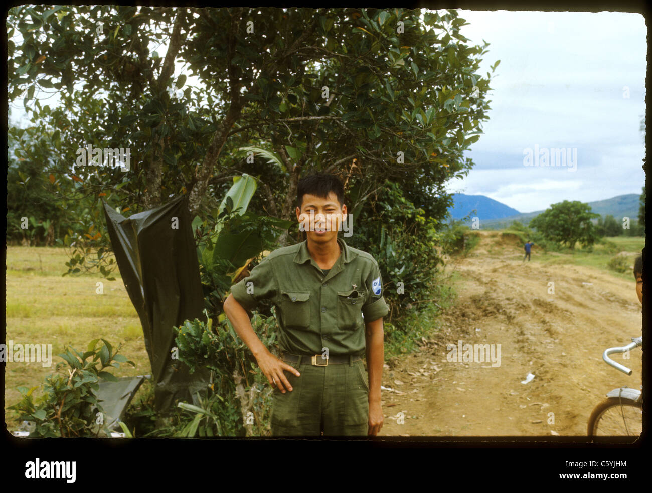ARVN Army of Republic of Vietnam medic standing next to dirt road ...