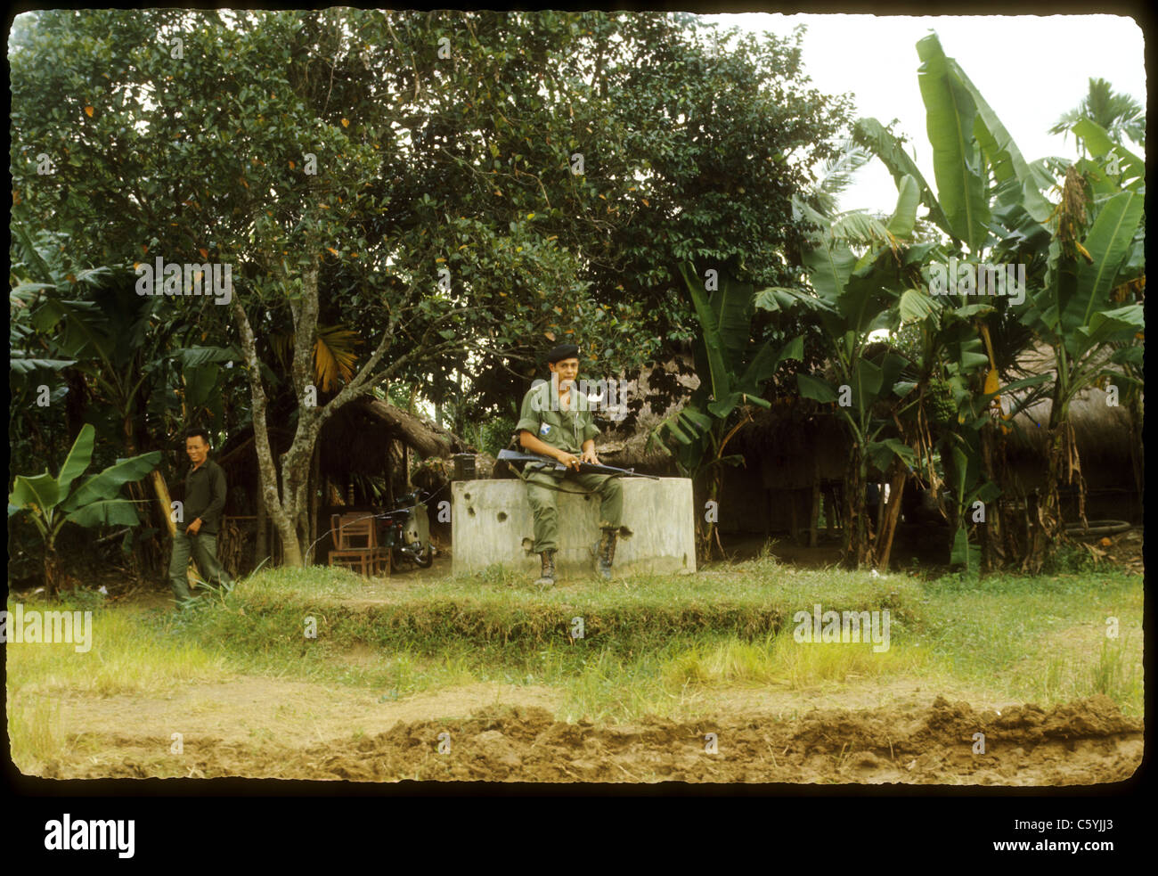 ARVN Army of Republic of Vietnam troop standing guard with M-16 during ...