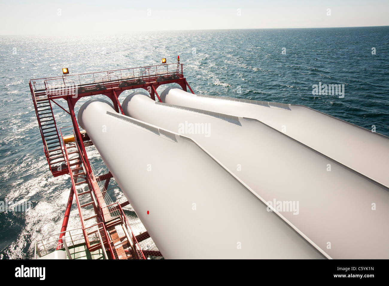Wind turbine blades on a jack up barge constructing the Walney offshore ...