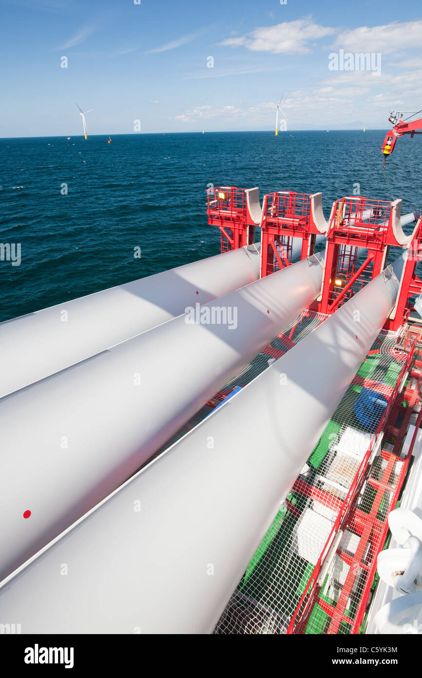Wind turbine blades on a jack up barge constructing the Walney offshore ...