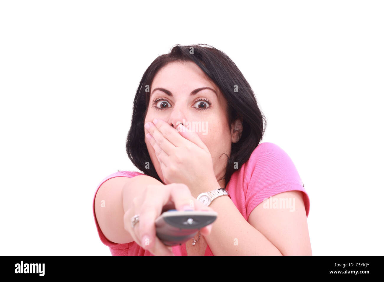 Scared young woman while watching TV in a white background Stock Photo ...