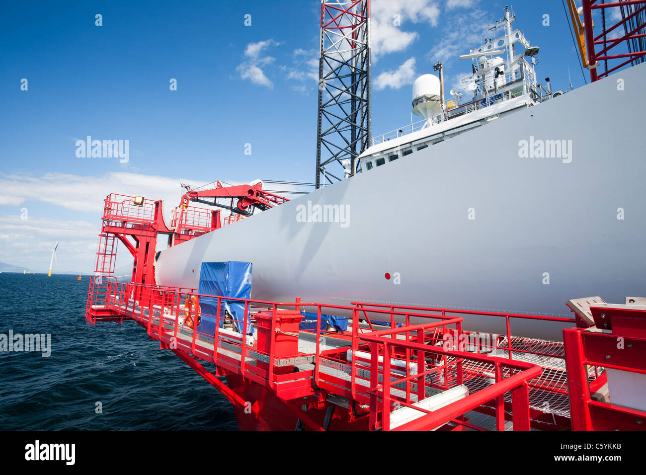 Wind turbine blades on a jack up barge constructing the Walney offshore ...