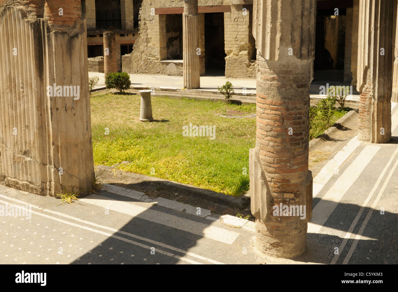 Courtyard (peristyle) with columns and mosaic tiled floor, House of the ...