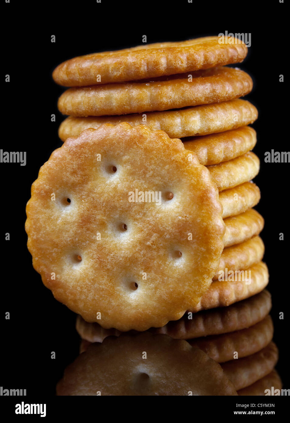 Salt round crackers group closeup on black Stock Photo - Alamy