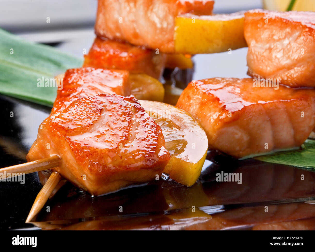 Red fish salmon fried kebab with lemon clice Stock Photo - Alamy