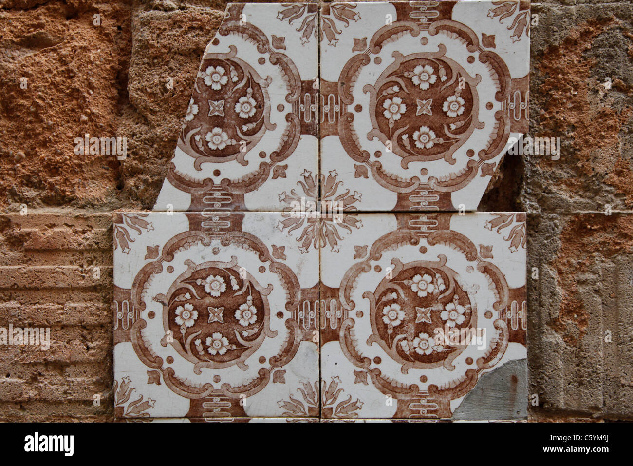 Some red azulejo tiles in poor condition Stock Photo - Alamy
