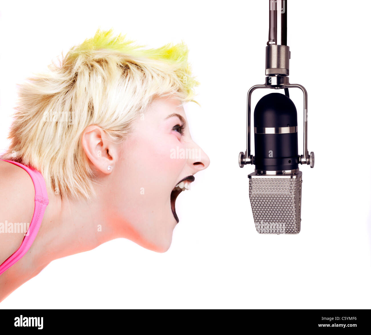 Isolated image of a blonde punk girl shouting at a microphone Stock ...