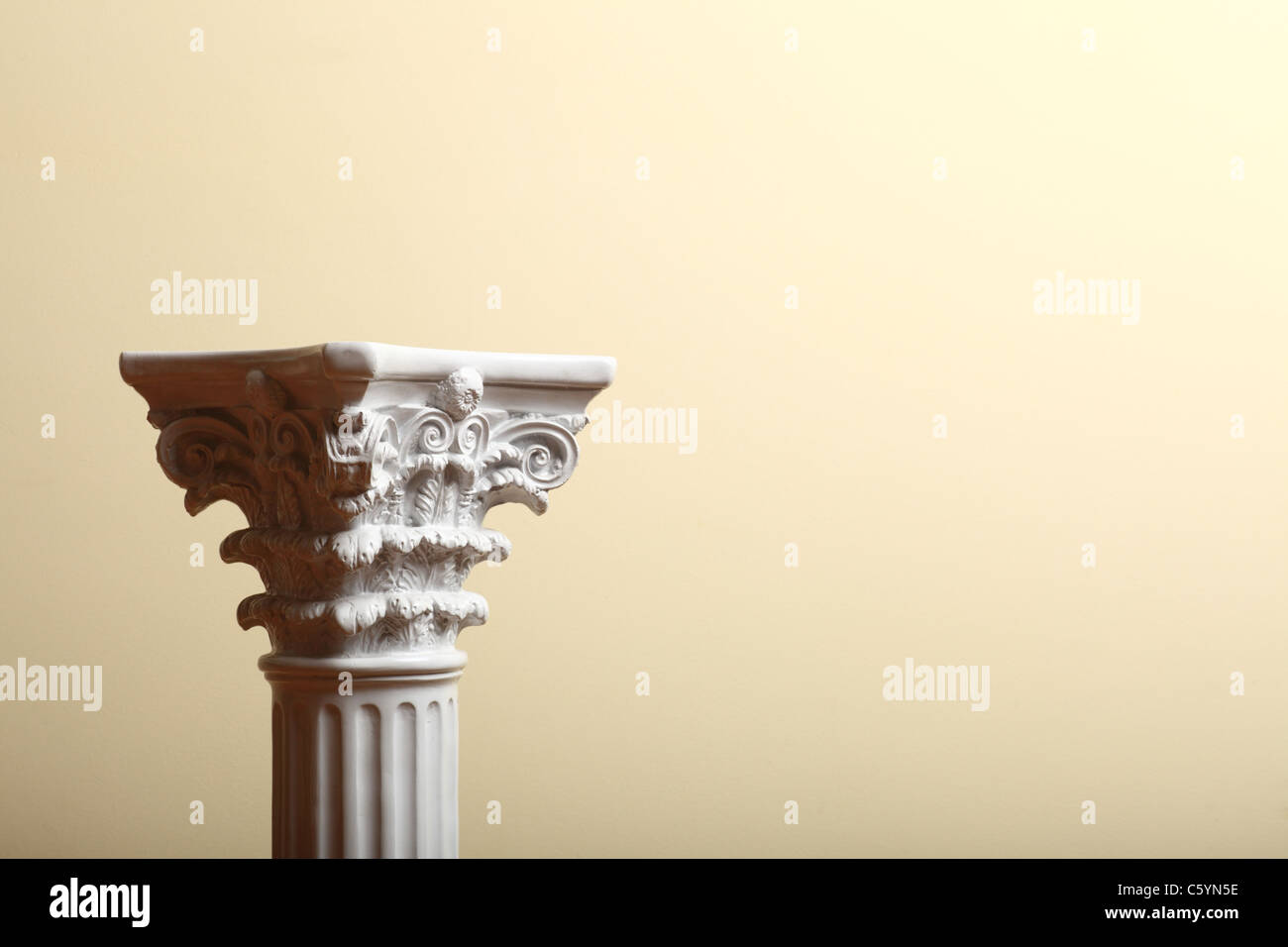 white column indoor on yellow background Stock Photo - Alamy