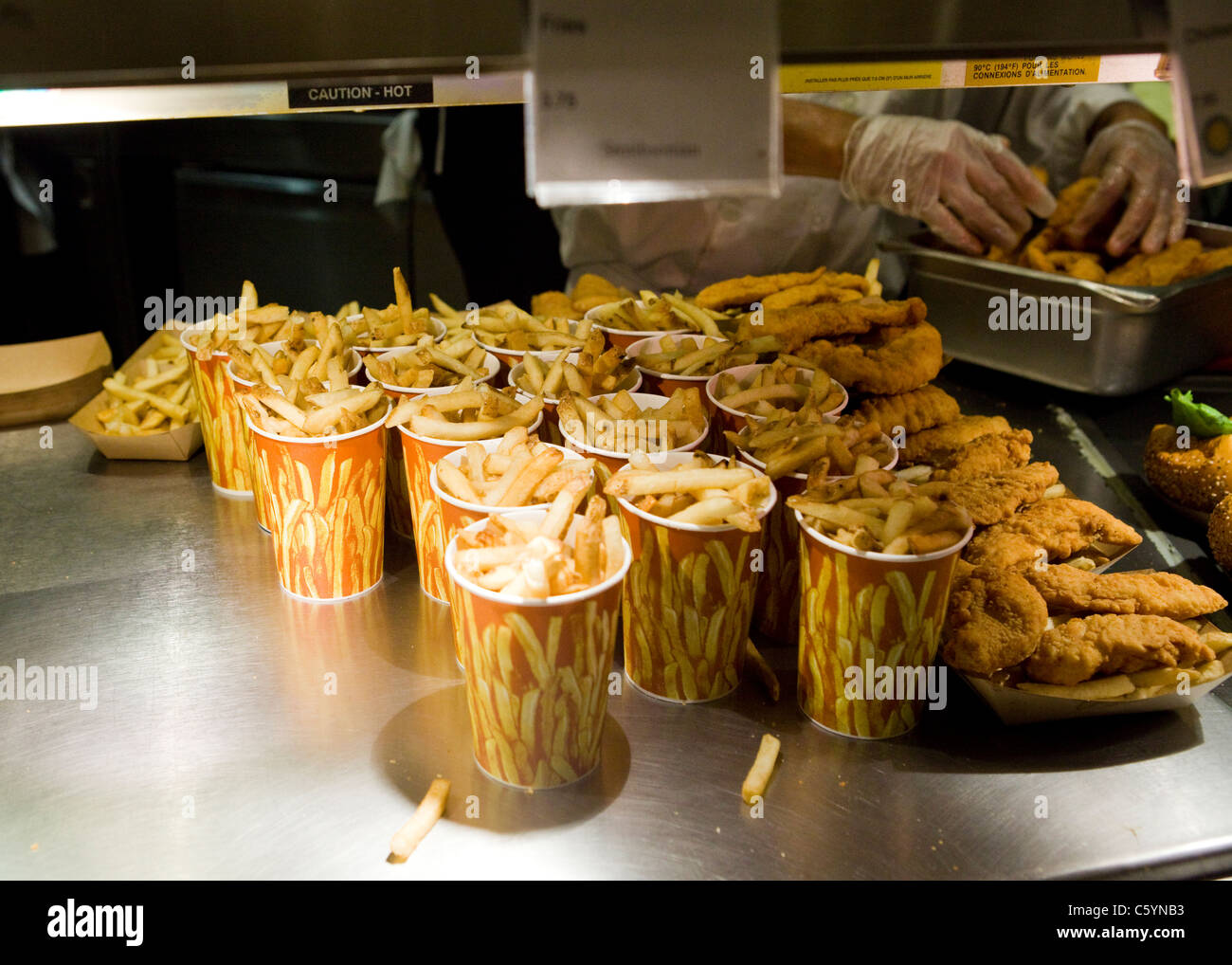 Cafeteria French fries in cup Stock Photo - Alamy
